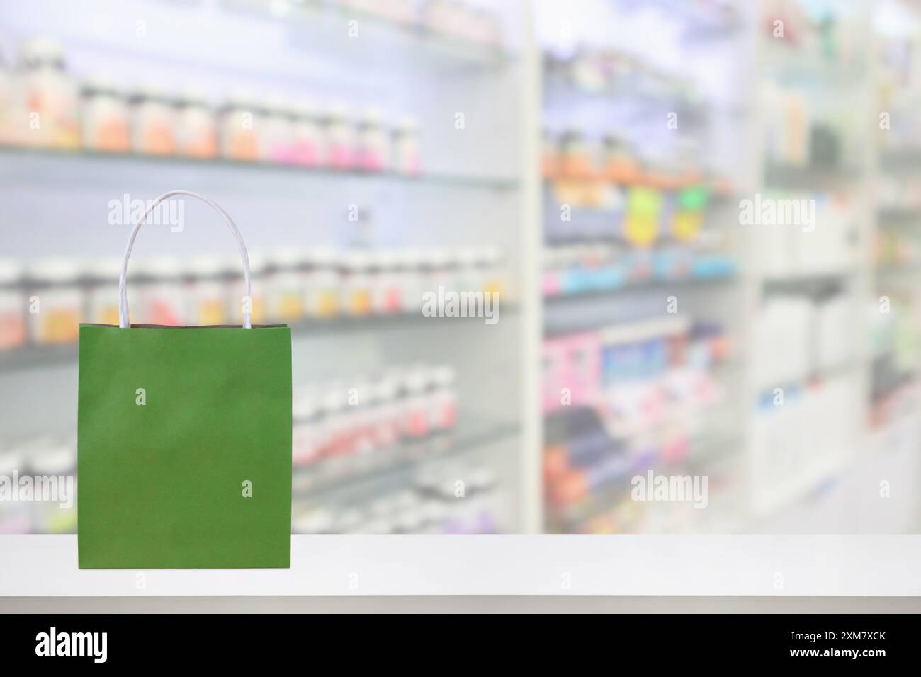 Paper bag on Pharmacy drugstore counter table with medicine and ...