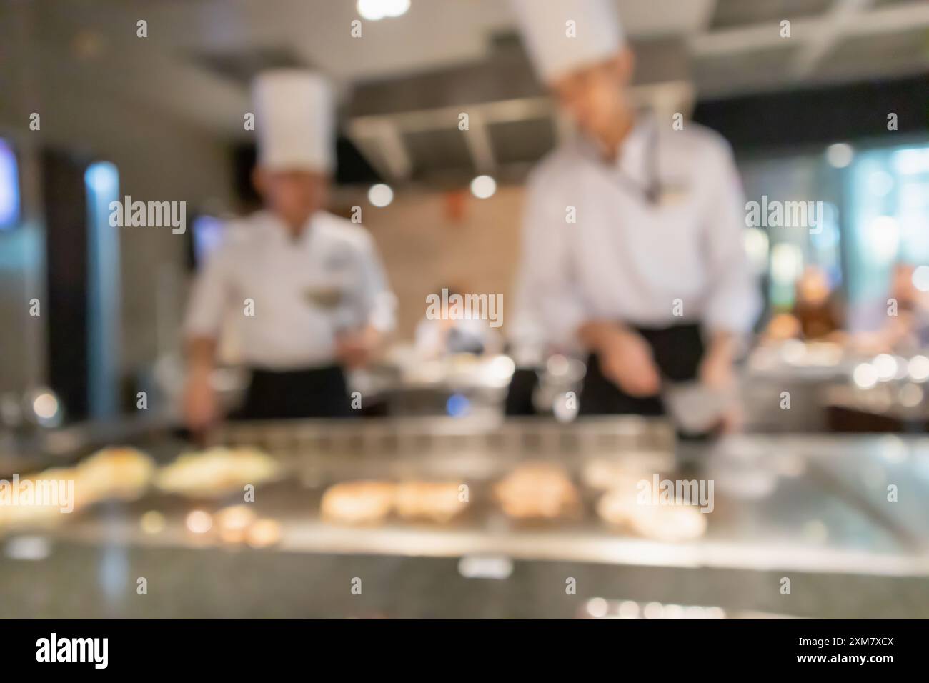 Chef cooking in restaurant kitchen blurred defocused background Stock ...