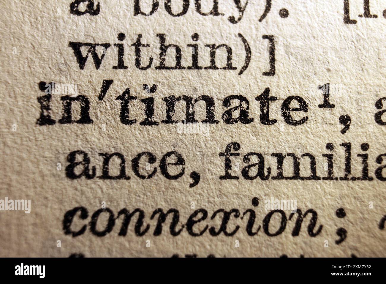 Word intimate on dictionary page, macro close-up Stock Photo - Alamy