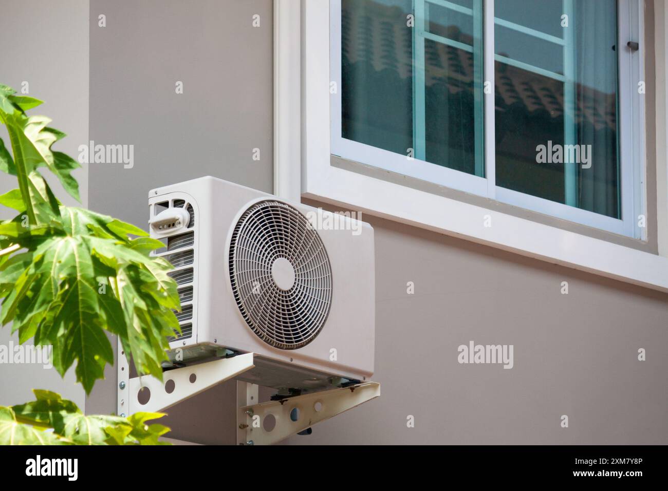 Air conditioner compressor outdoor unit installed outside the house ...