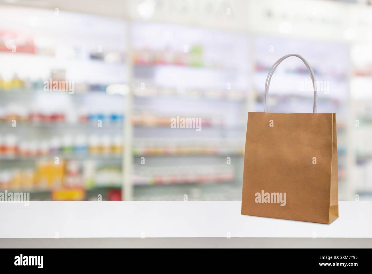 Paper bag on Pharmacy drugstore counter table with medicine and ...
