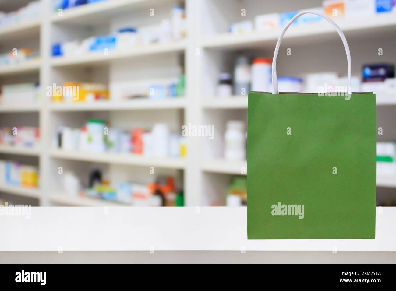 Paper bag on Pharmacy drugstore counter table with medicine and ...
