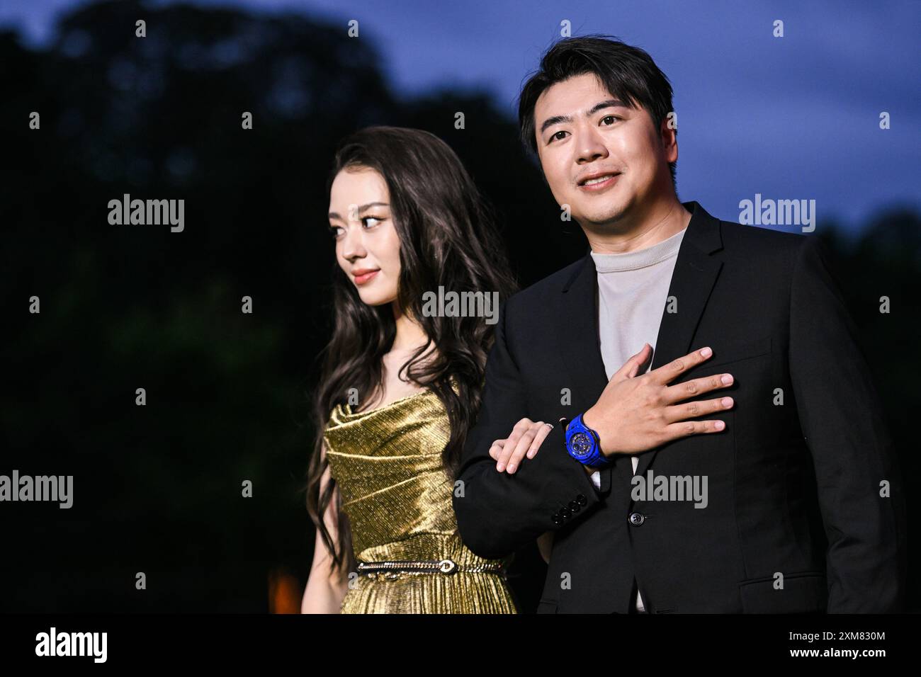 Paris, France. 26th July, 2024. Gina Alice Redlinger and Lang Lang posing for photos on the red ...