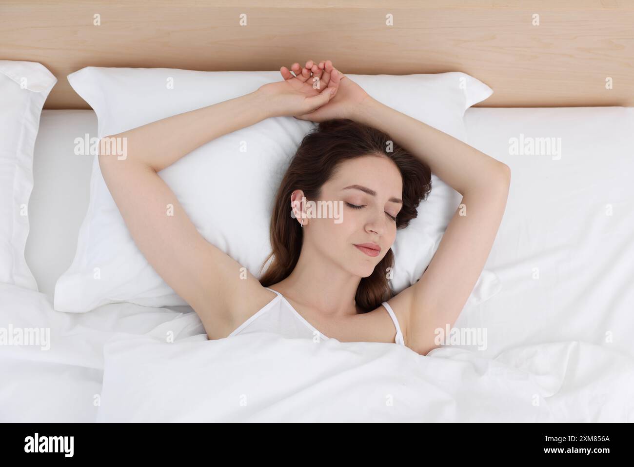 Bedtime. Woman sleeping in bed at home, top view Stock Photo - Alamy