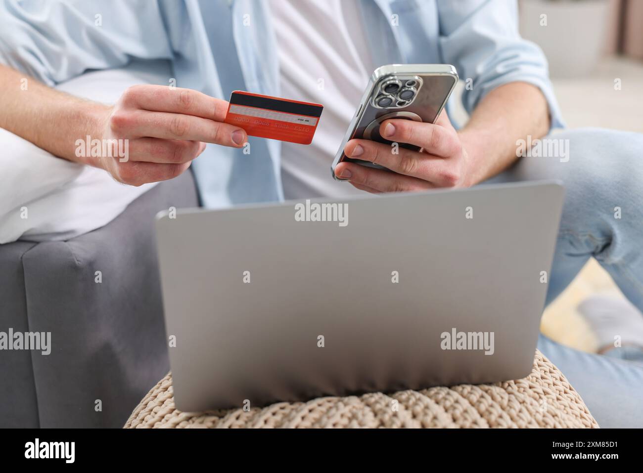 Online banking. Man with credit card and laptop paying purchase at home ...