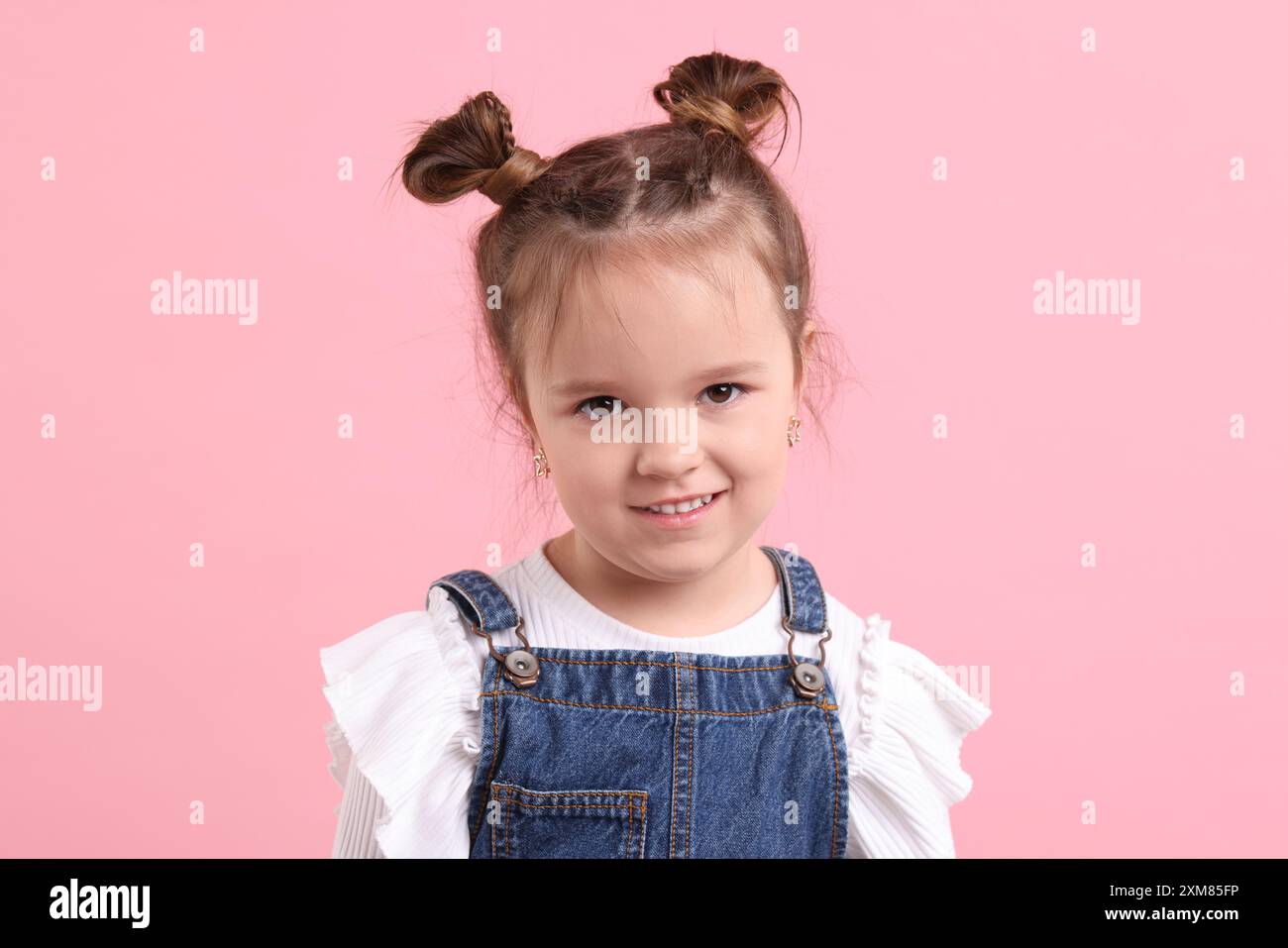 Portrait of cute little girl on pink background Stock Photo - Alamy