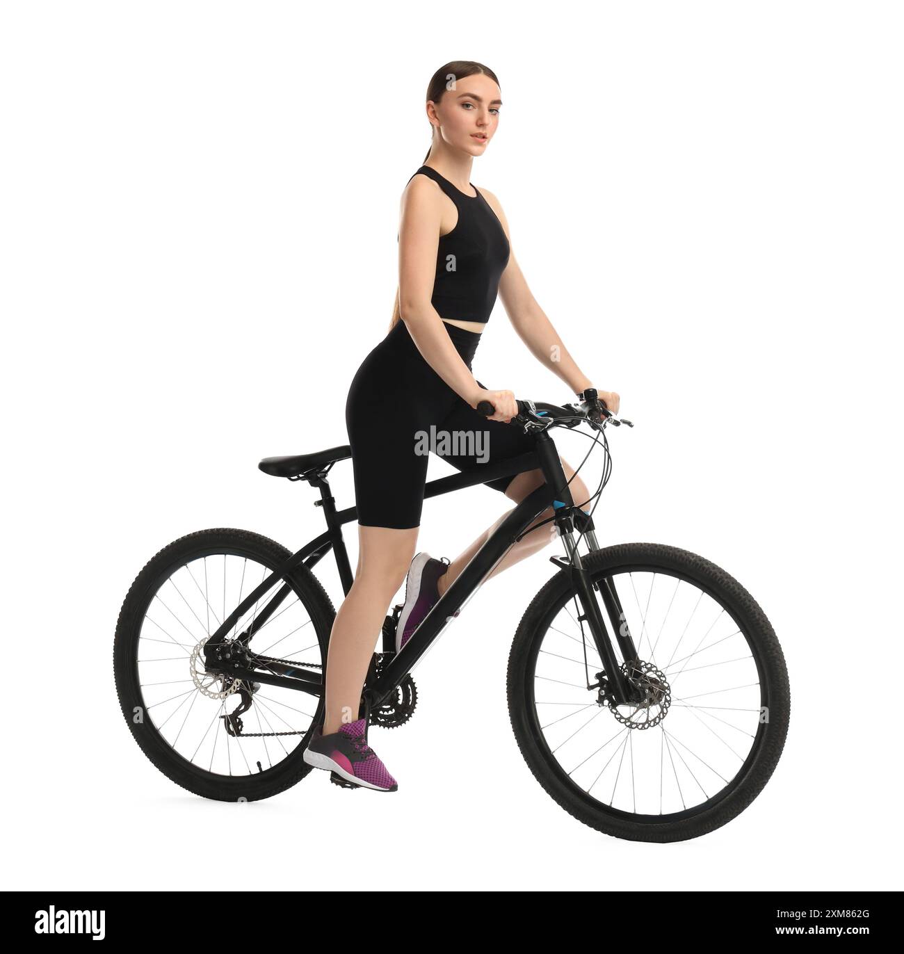 Beautiful young woman riding bicycle on white background Stock Photo ...