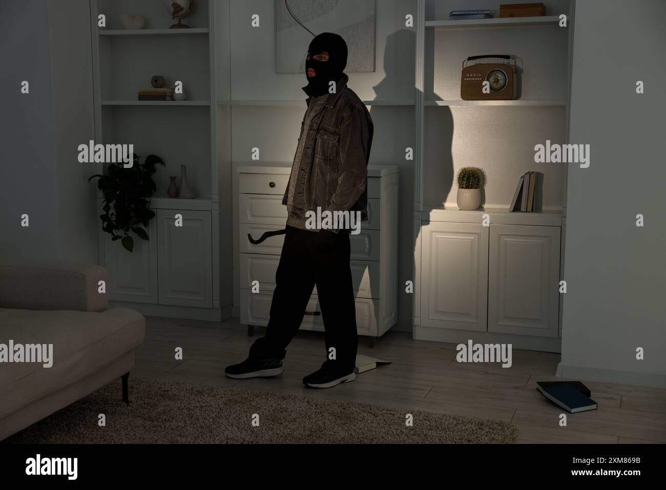 Thief with crowbar sneaking at foreign house. Burglary Stock Photo - Alamy