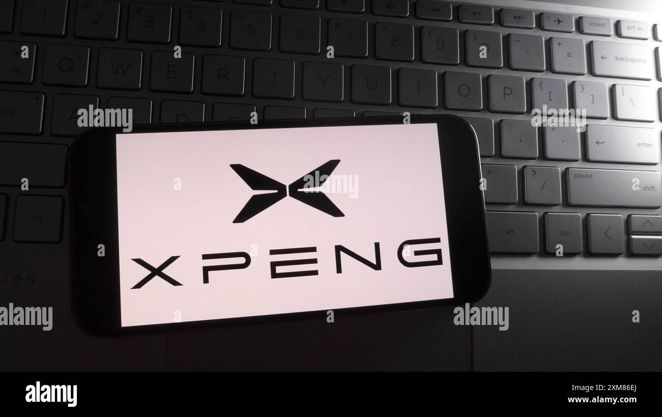 In this photo illustration, XPENG logo is displayed on a smartphone ...