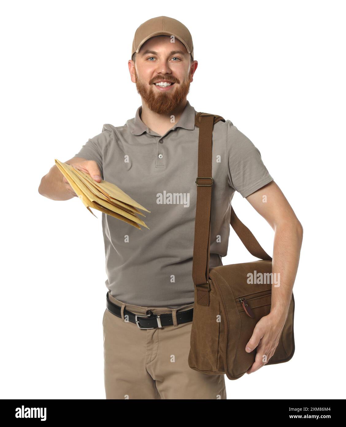 Happy young postman with brown bag delivering letters on white ...