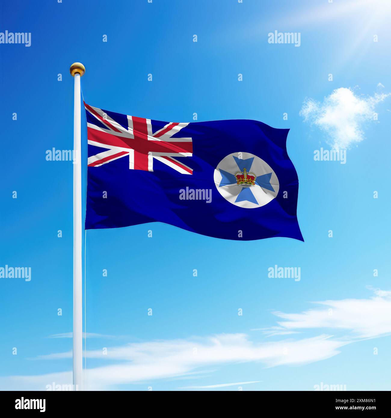 Waving flag of Queensland is a state of Australia on flagpole with sky ...