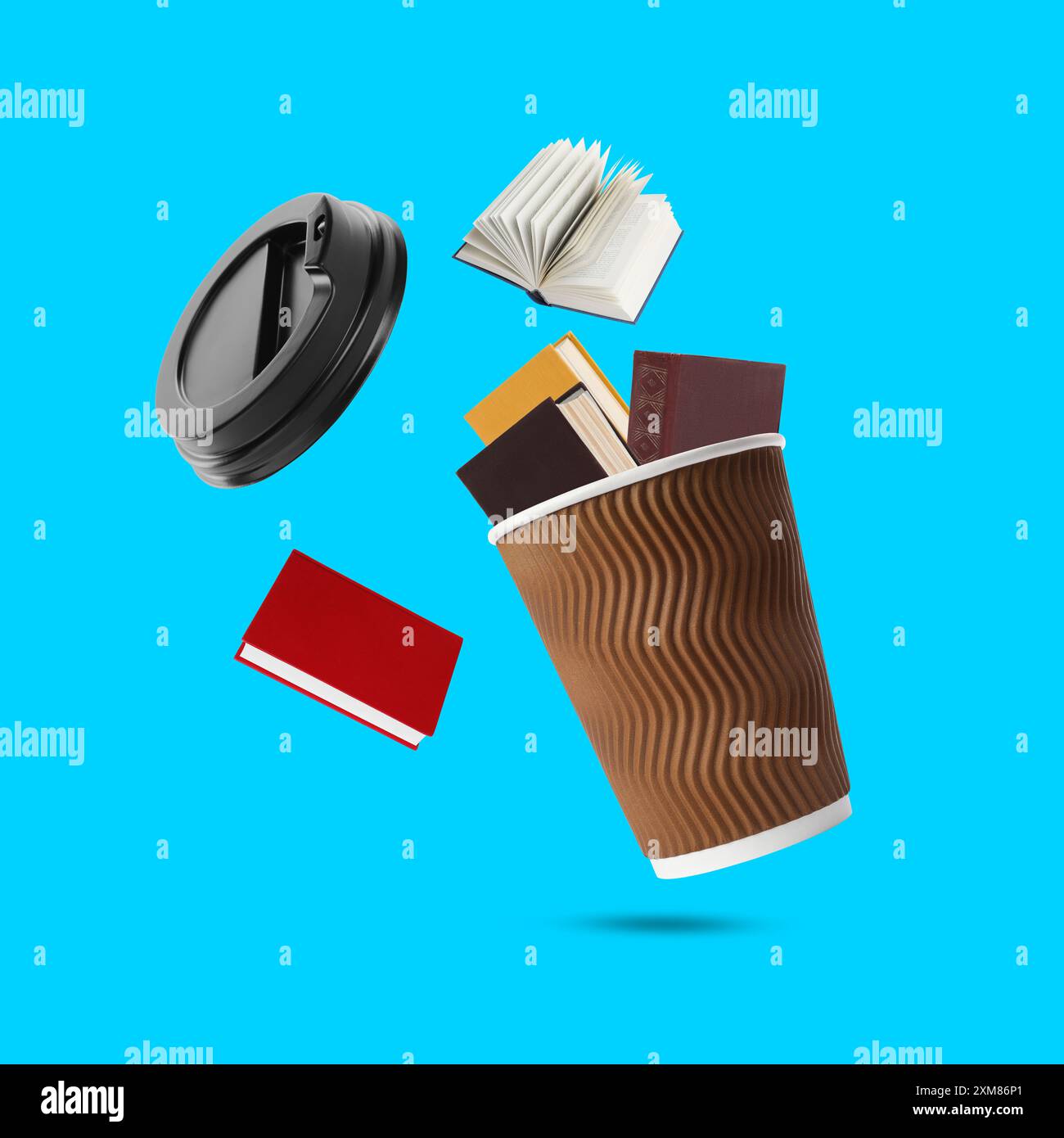 Takeaway paper cup with books in air on light blue background Stock ...