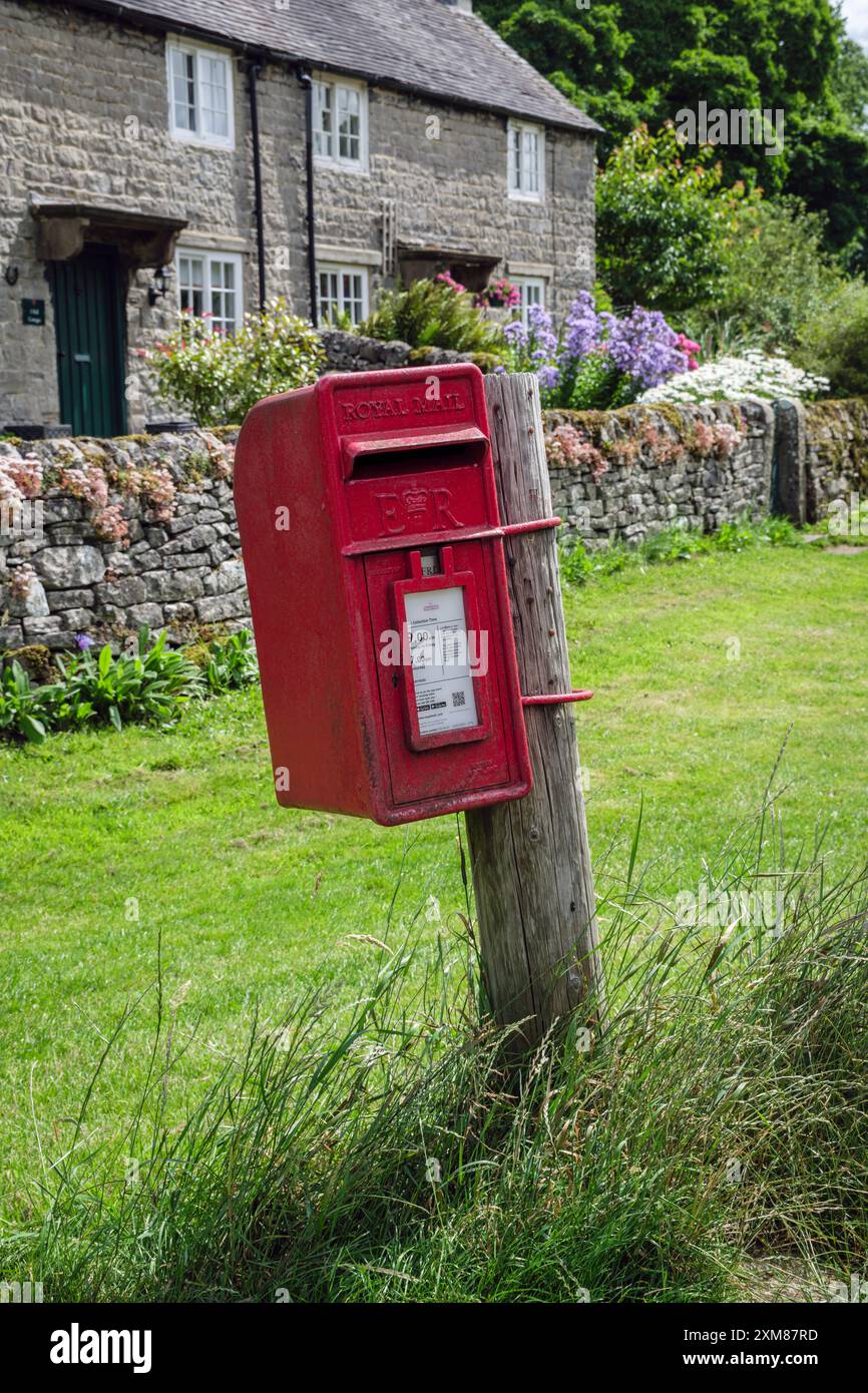 A post box in the Peak District village of Tissington, Derbyshire Stock ...