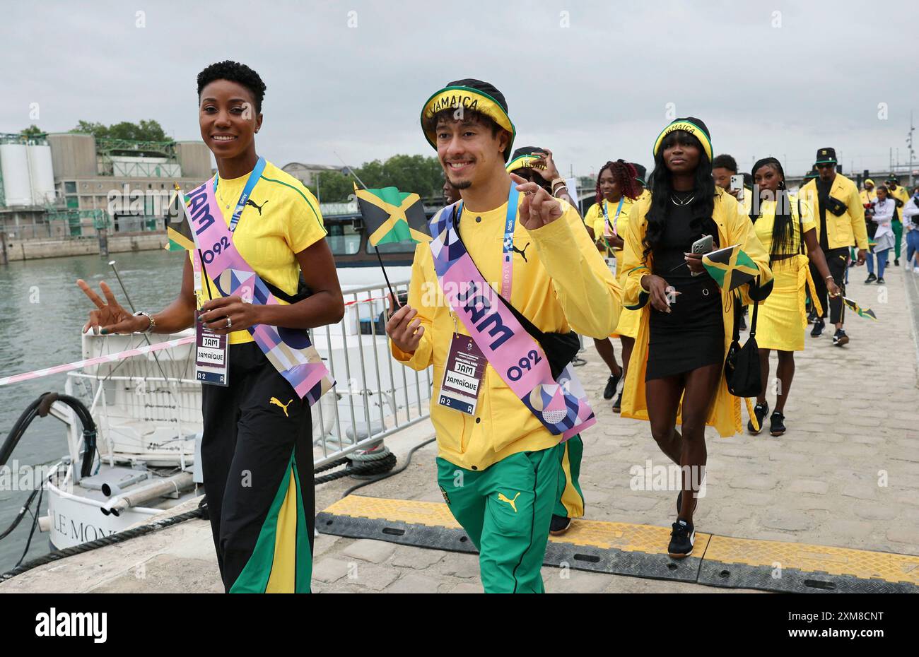 Flagbearers Josh Kirlew and Shanieka Ricketts of Jamaica arrive to ...