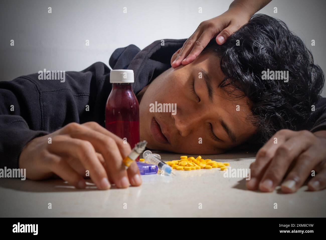woman's hand checking condition of man unknowingly drug addict ...