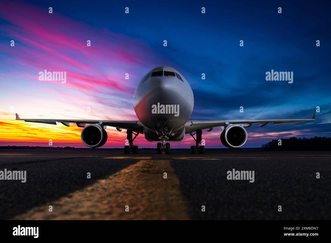 Front view of the wide body passenger aircraft at the airport apron ...