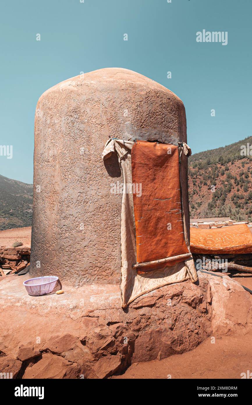 A traditional stone structure with a rounded top, situated in a rural ...