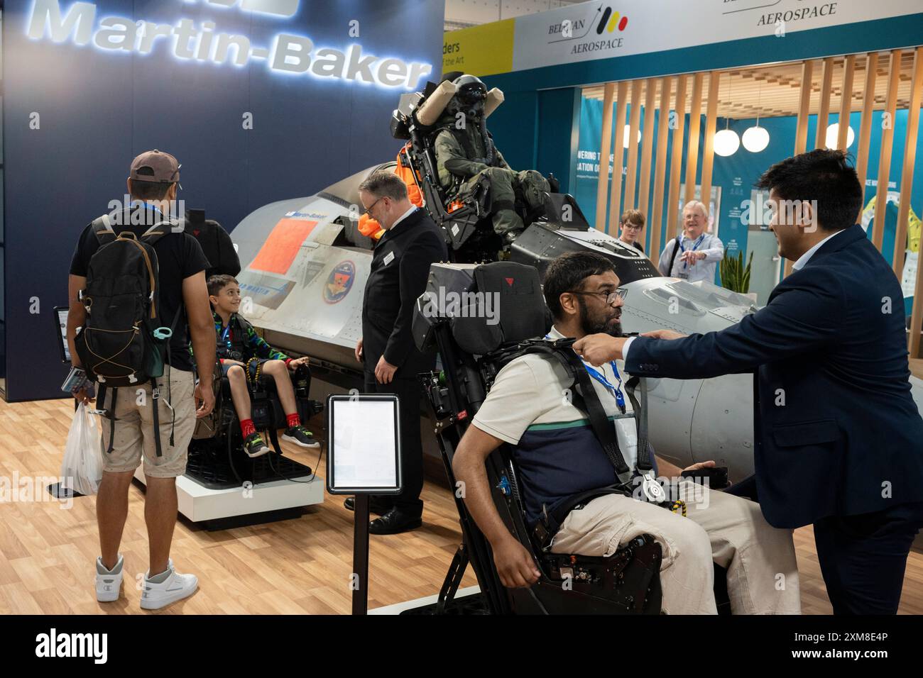 Visitors participate with Martin-Baker company's ejection seat ...