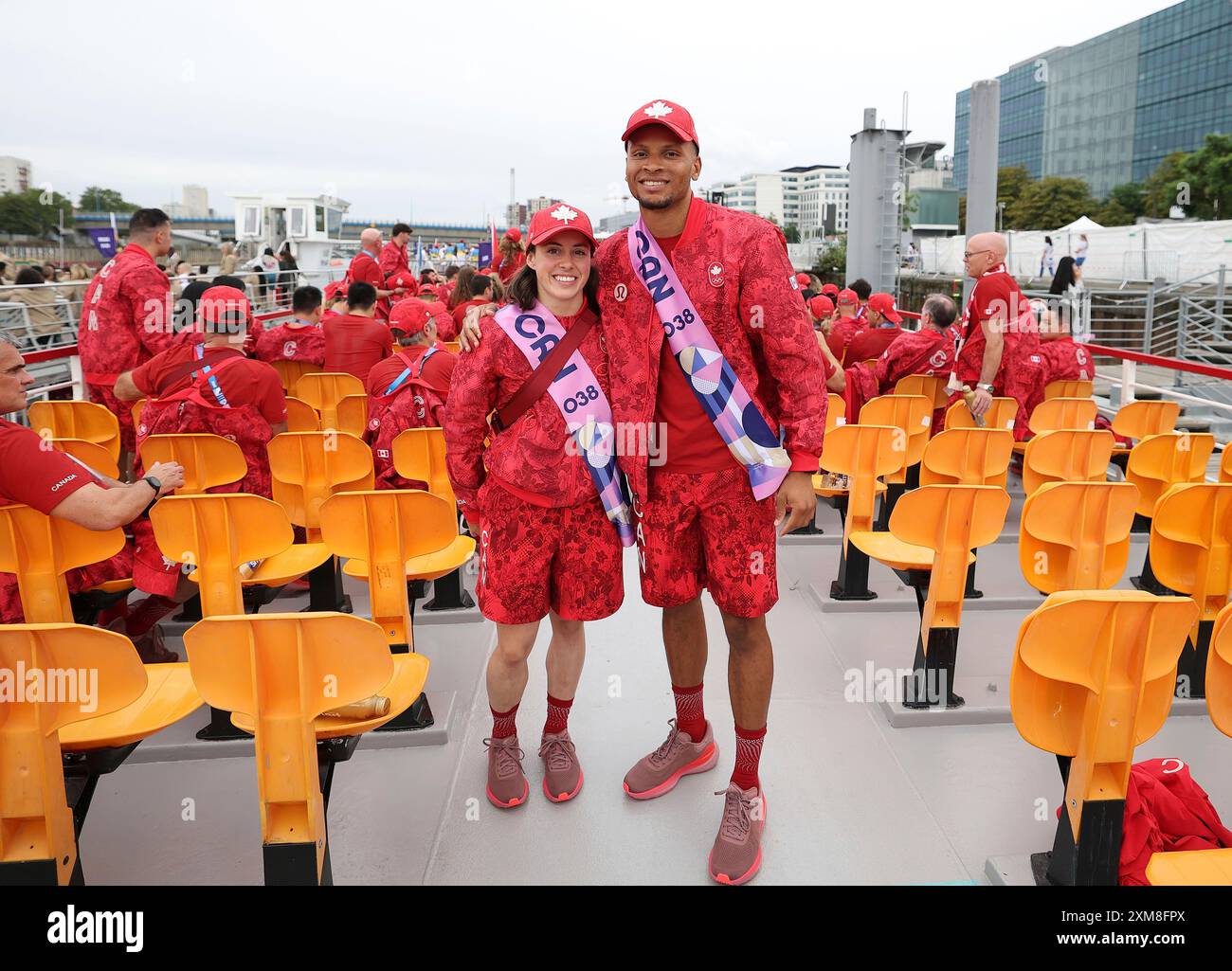 Canada's flagbearers Maude Charron, left, and Andre de Grasse pose for photos on their team's ...