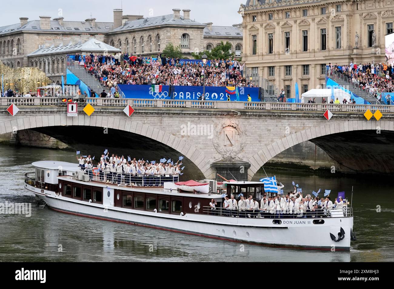 Greece's team goes down the Seine River in Paris, France, during the ...