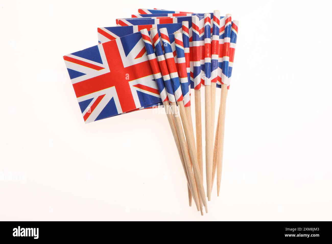 Small paper flags of United Kingdom isolated on white Stock Photo - Alamy