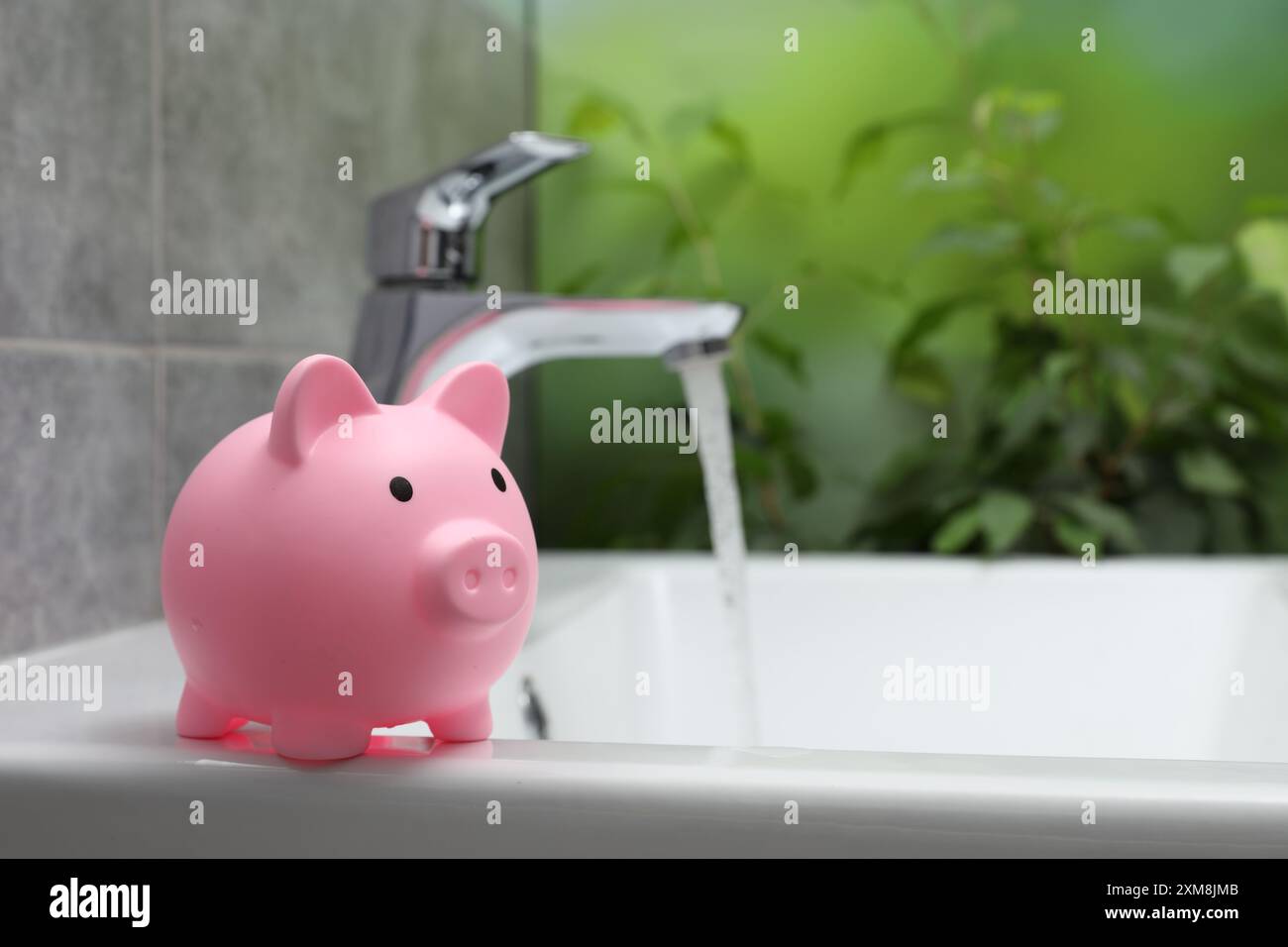 Water saving concept. Piggy bank and stream of water flowing from tap ...