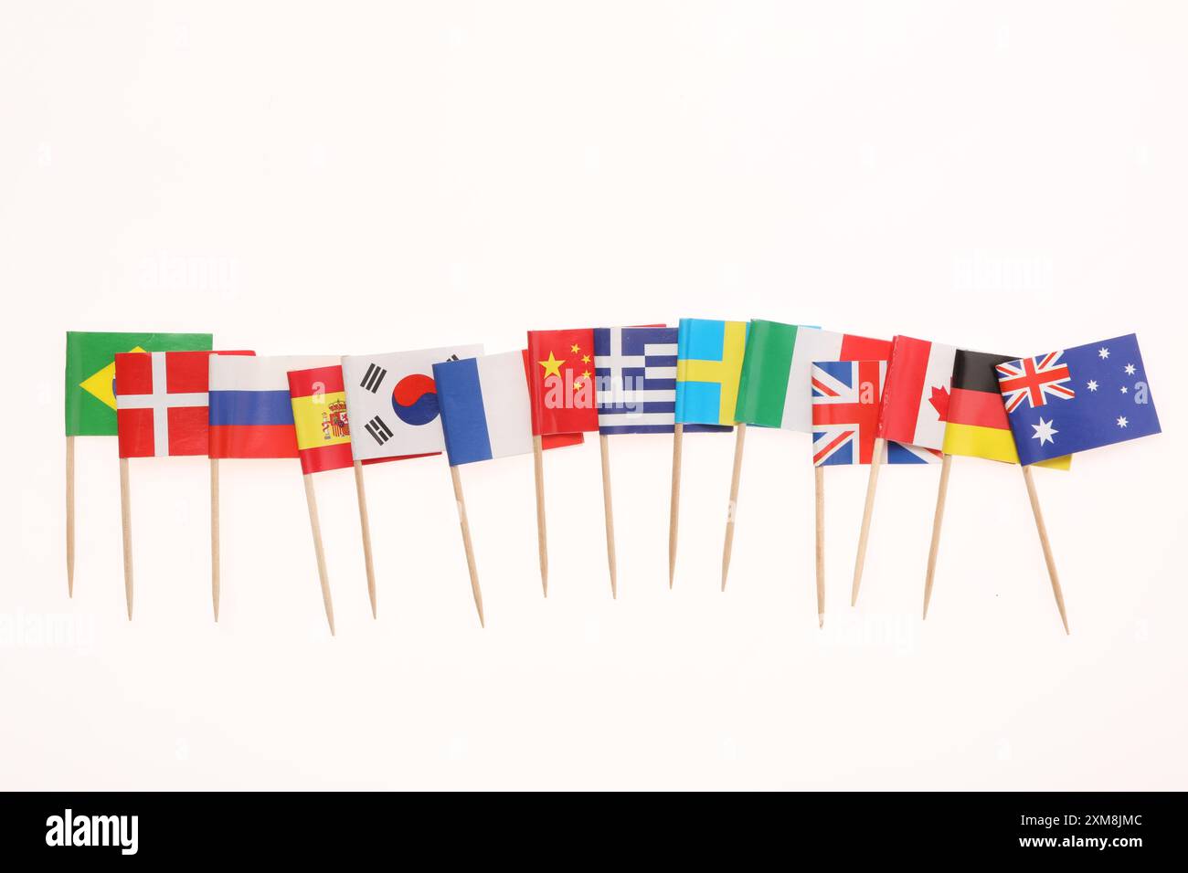 Small paper flags of different countries isolated on white Stock Photo ...