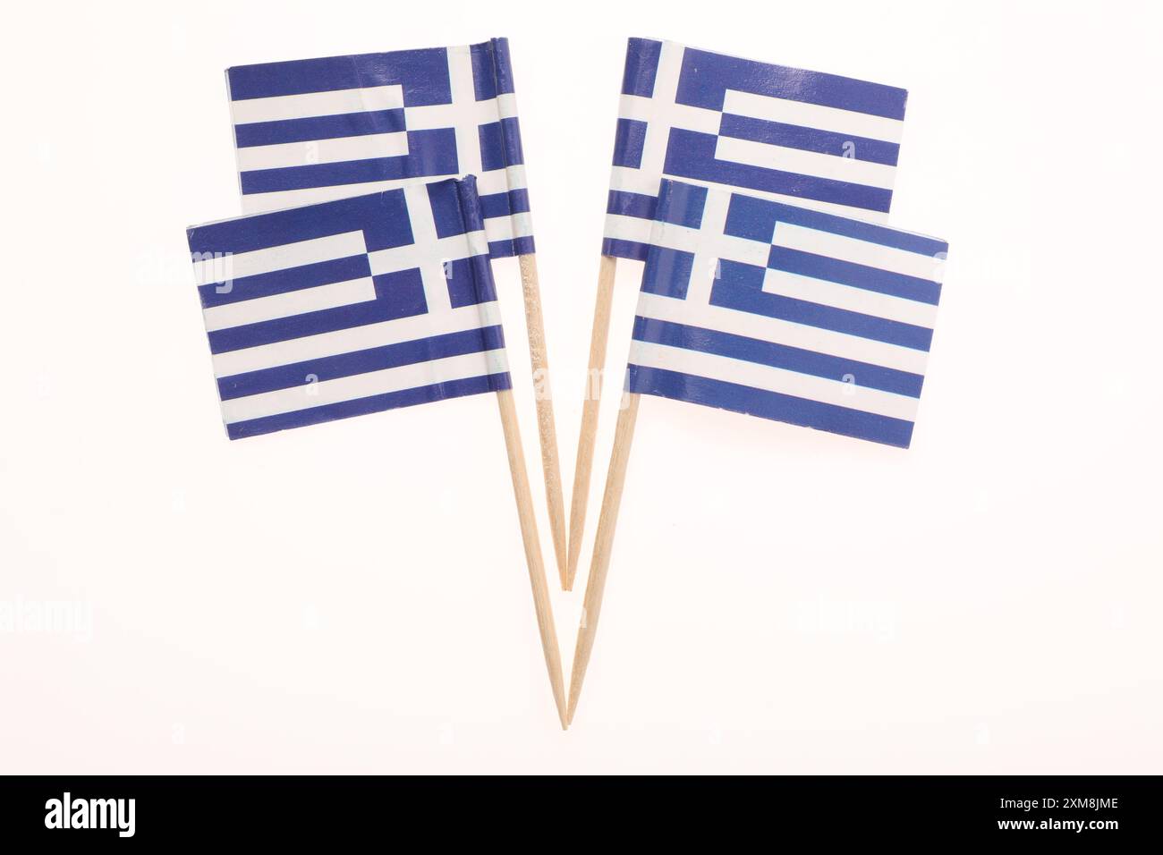 Small paper flags of Greece isolated on white Stock Photo - Alamy