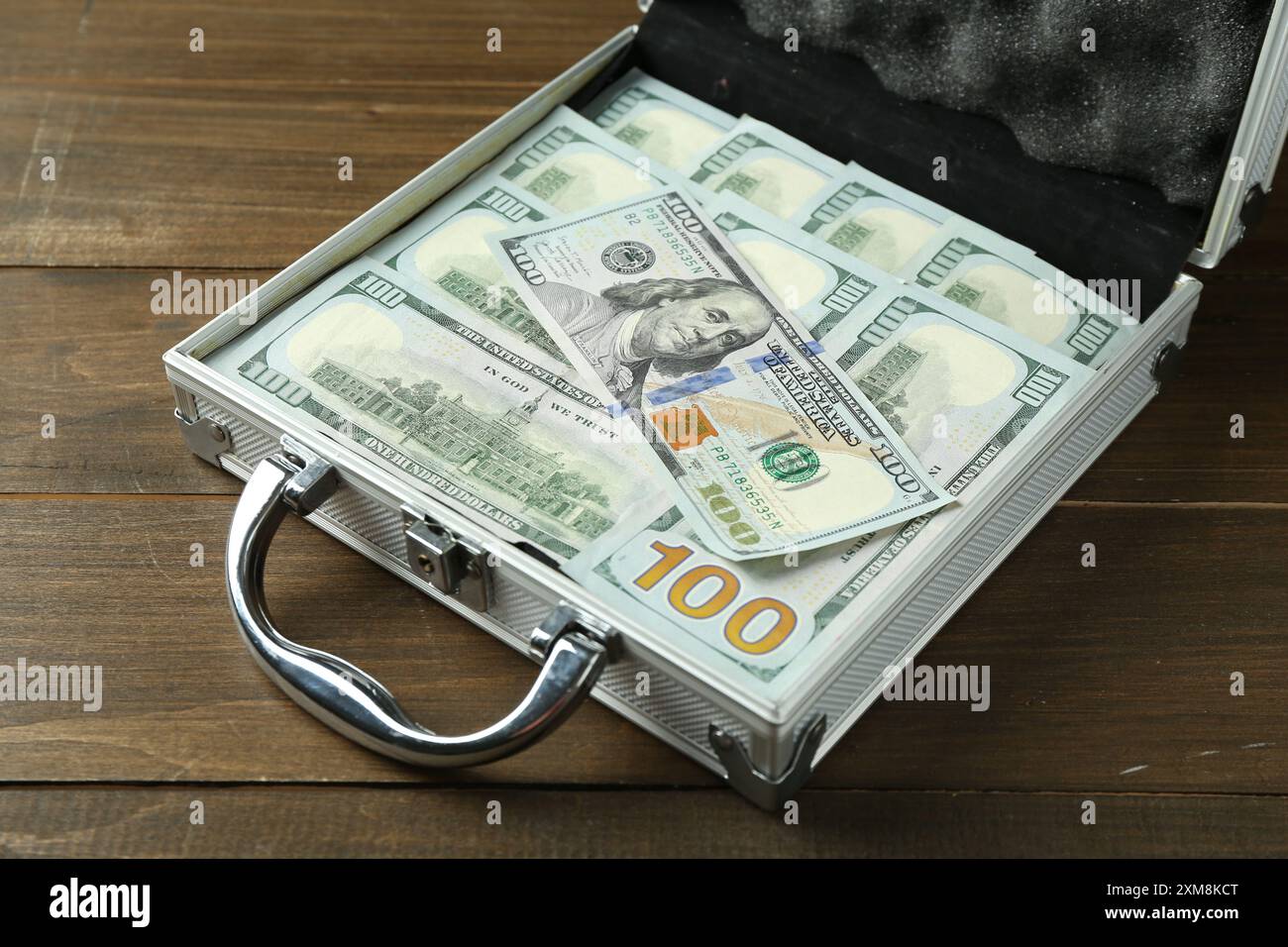 Metal case full dollar hi-res stock photography and images - Alamy