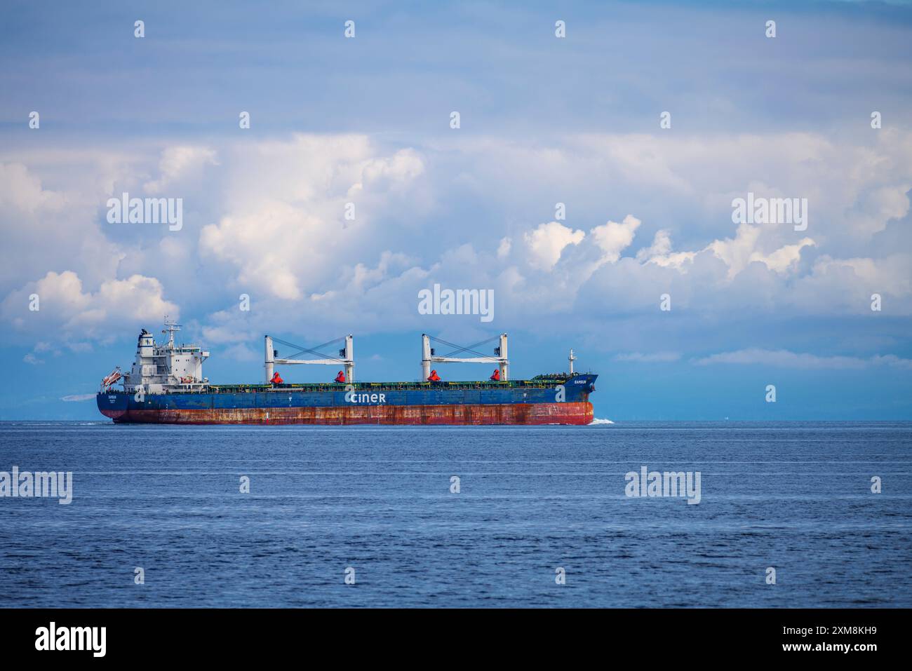 A cargo ship crossing the Straight of Georgia, bound for the port of ...