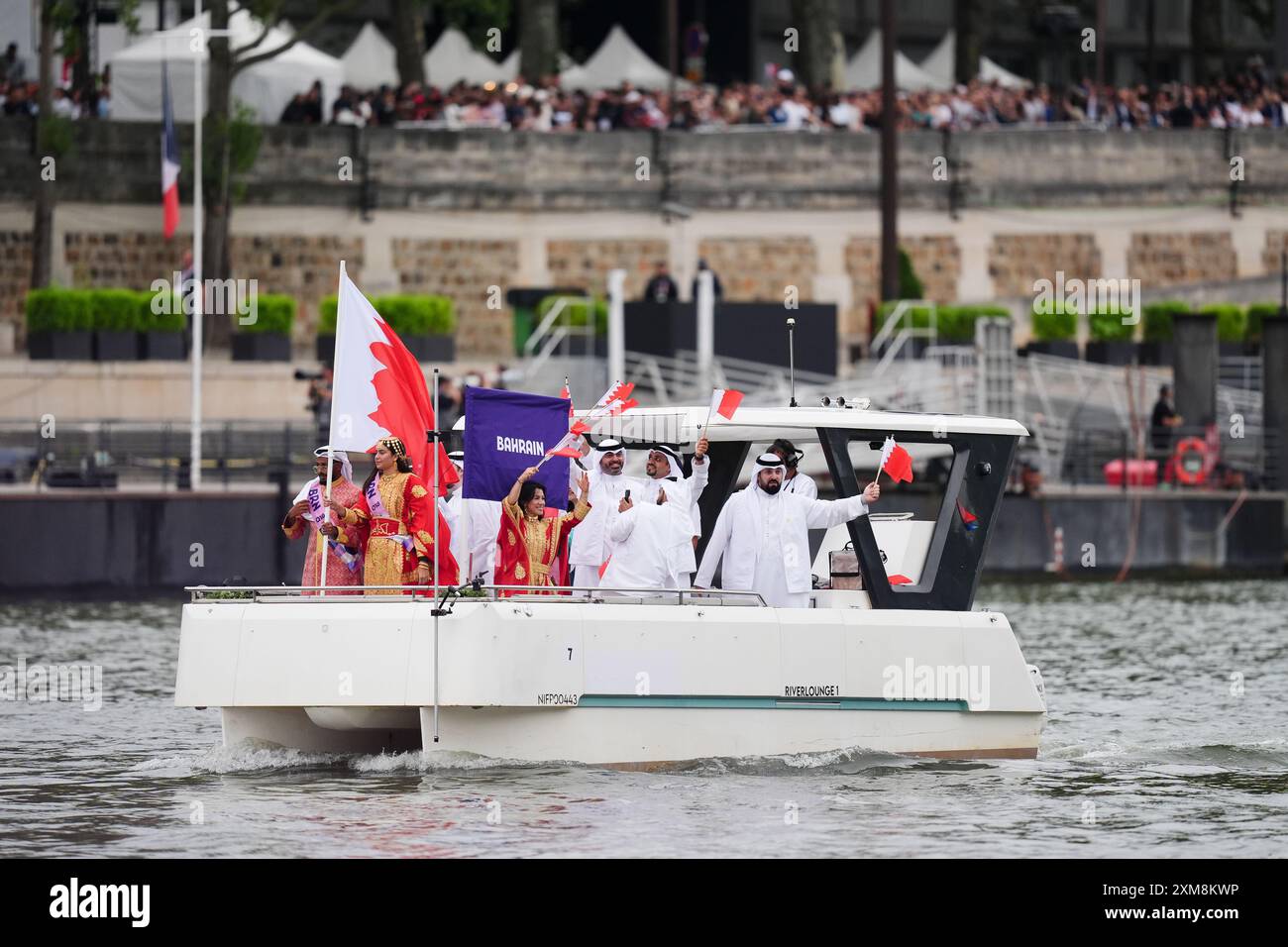 Bahrain flagbearers Amani Alobaidli and Saud Ghali and the Bahrain ...