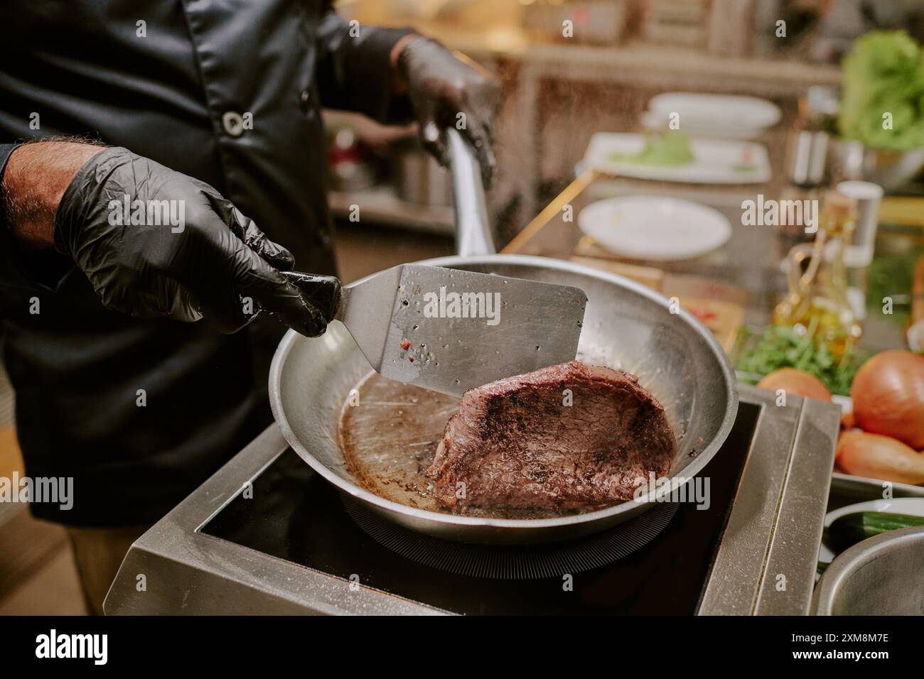 High angle shot of unrecognizable chef hands dressed in black latex ...