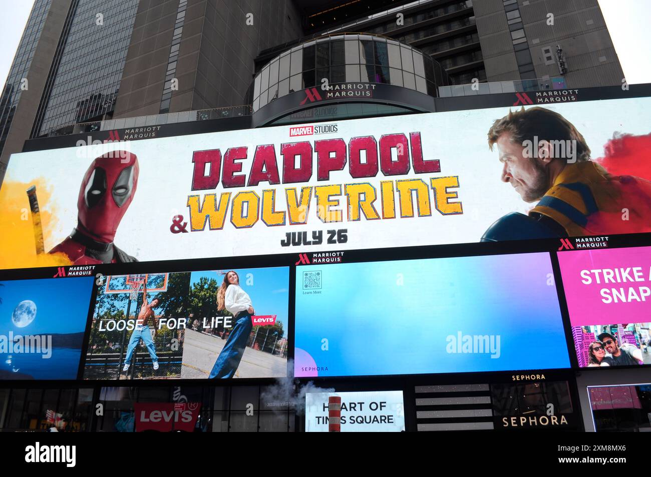 New York, USA. 25th July, 2024. A billboard for the film, Deadpool ...