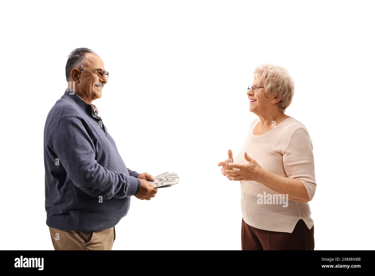 Mature man and woman talking and counting money isolated on white ...