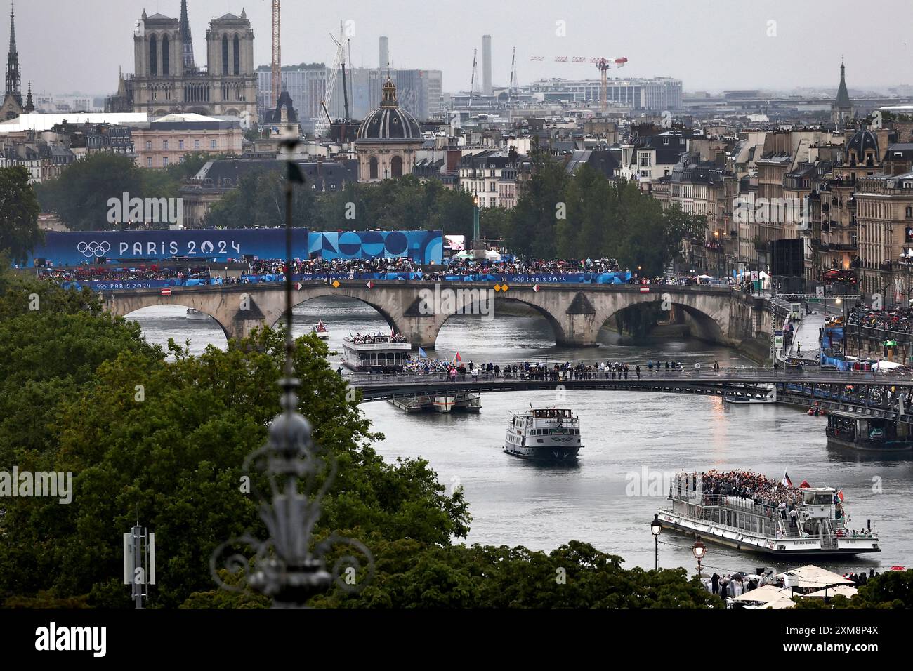 A general view shows delegations sailing on the Seine River during the ...