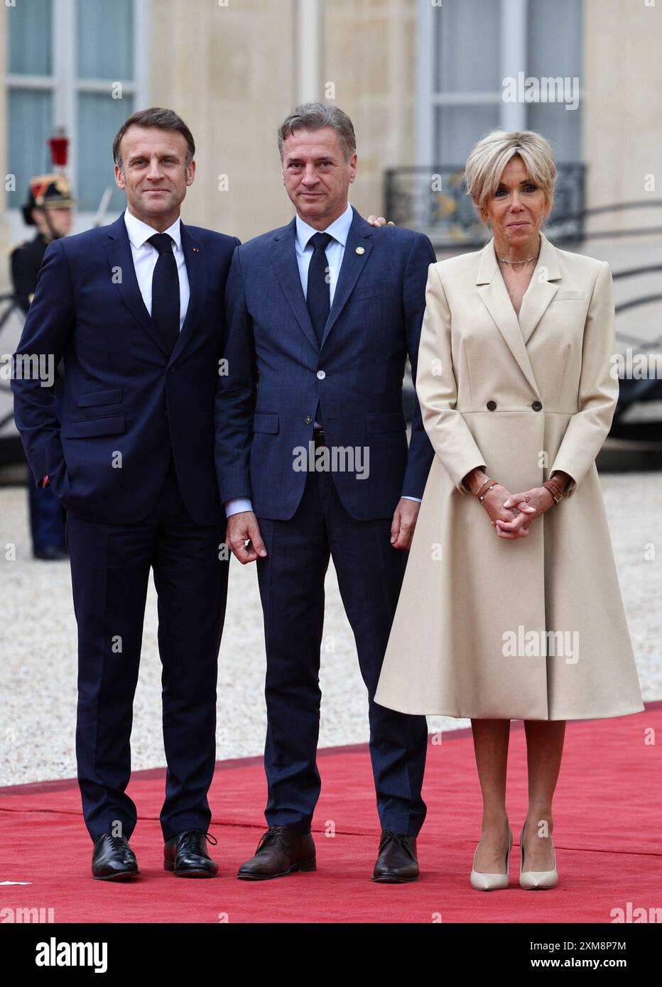 French President Emmanuel Macron, guest and Brigitte Macron attending ...