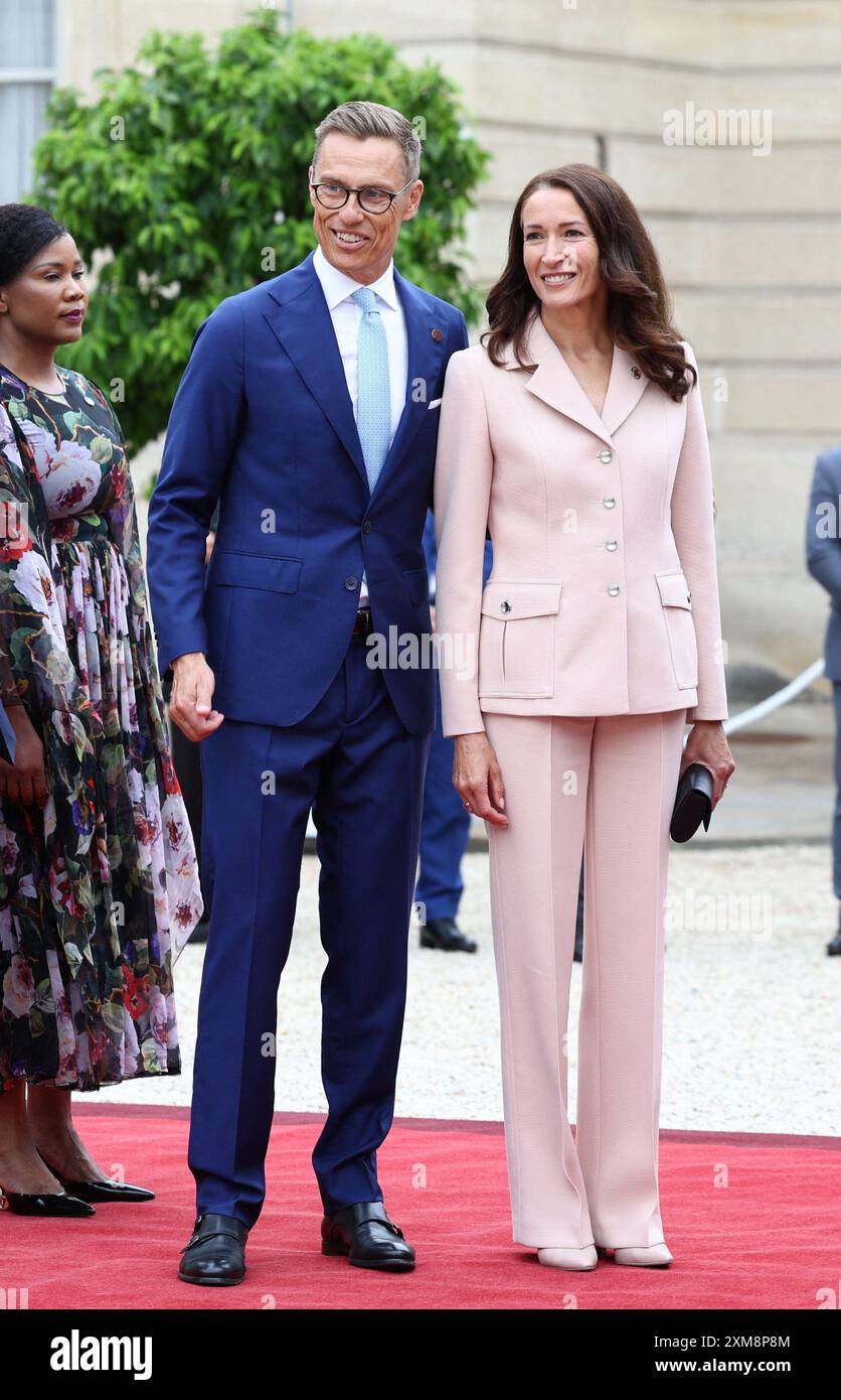 Finland's President Alexander Stubb and his wife Suzanne Innes-Stubb attending reception ...