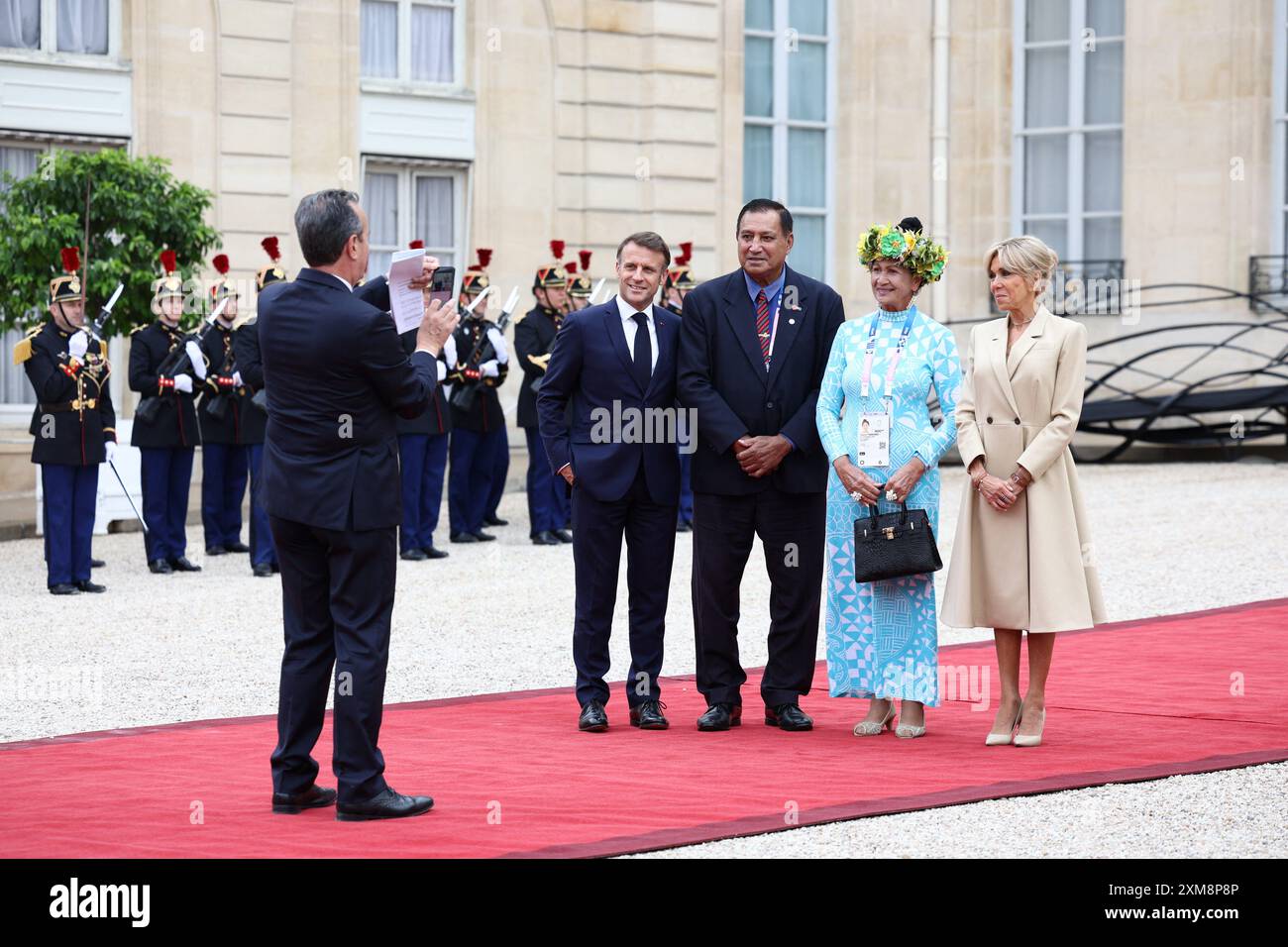 French President Emmanuel Macron, guest and Brigitte Macron attending ...