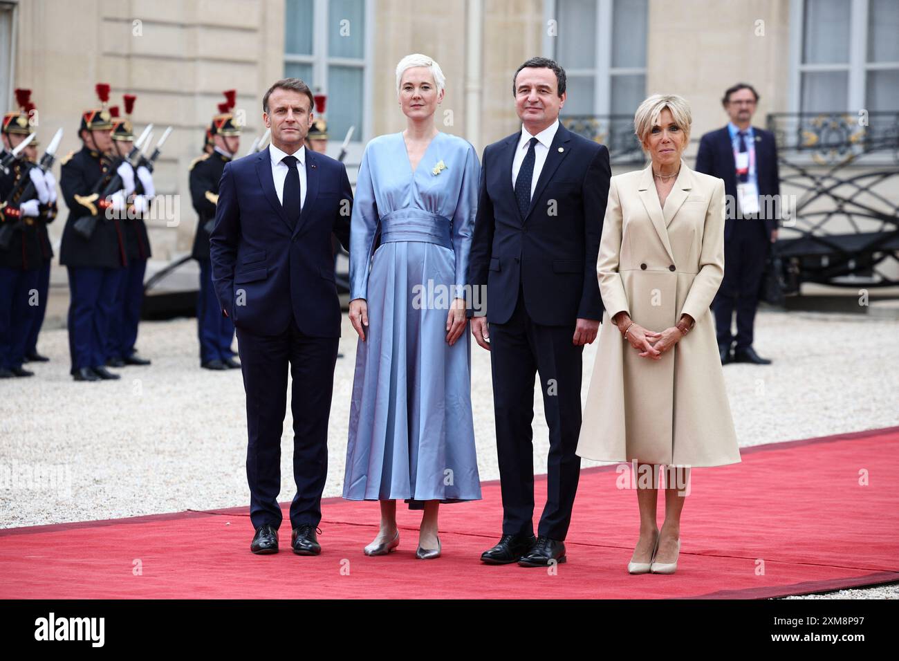 French president Emmanuel Macron, guest and Brigitte Macron attending ...