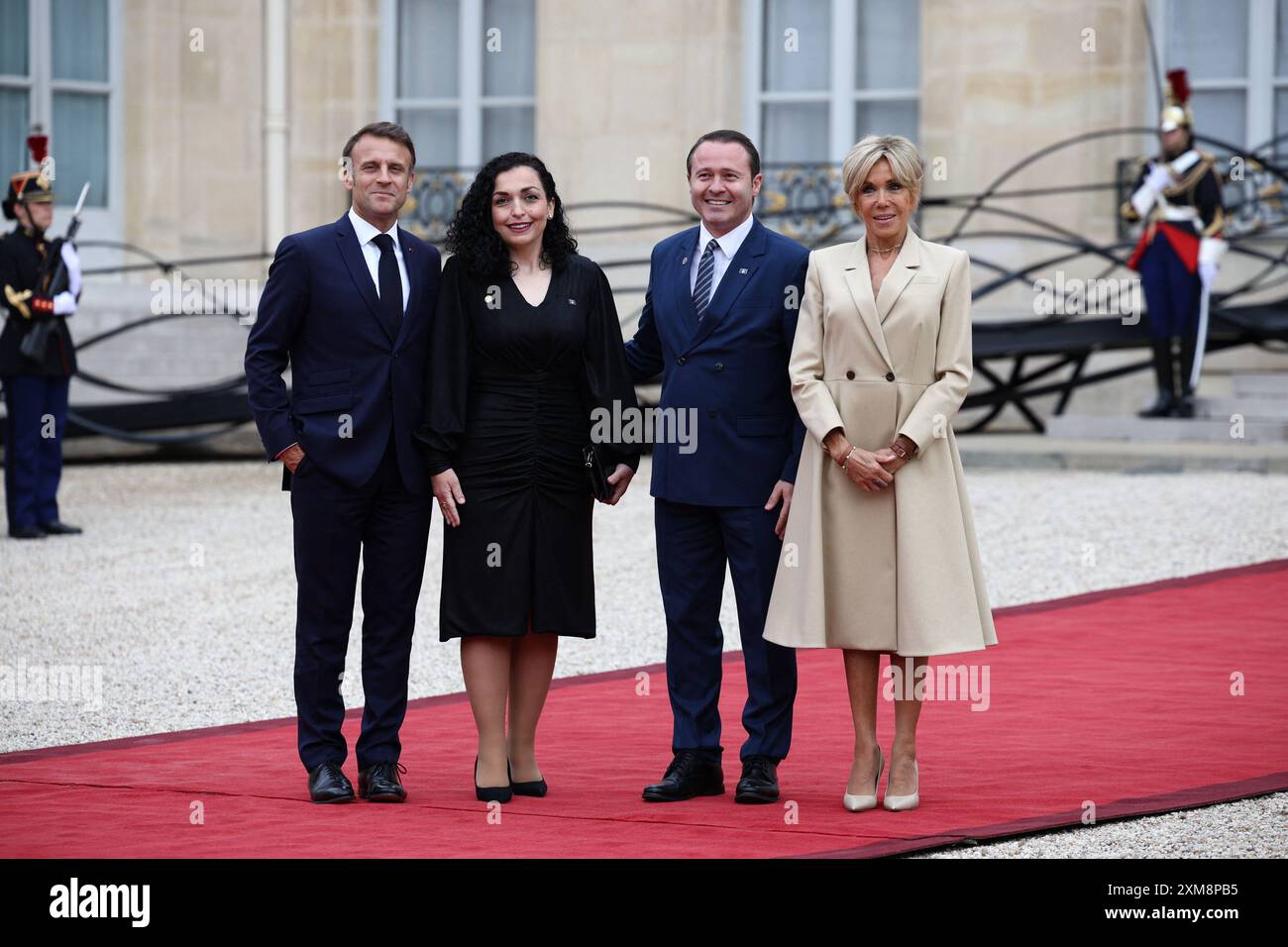 French President Emmanuel Macron, guest and Brigitte Macron attending ...