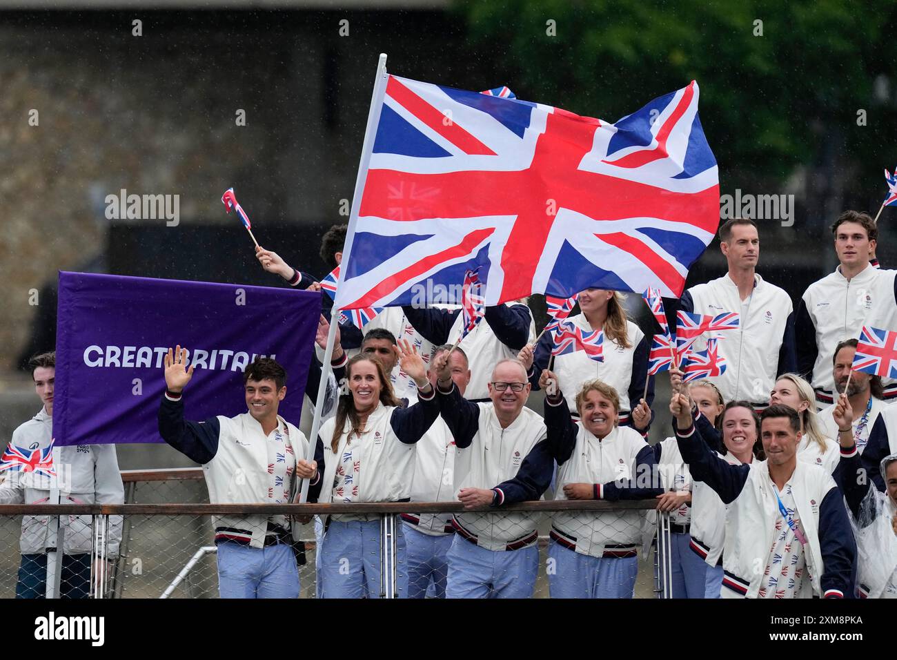 Britain's Thomas Daley and Helen Glover carry their country's flag in ...