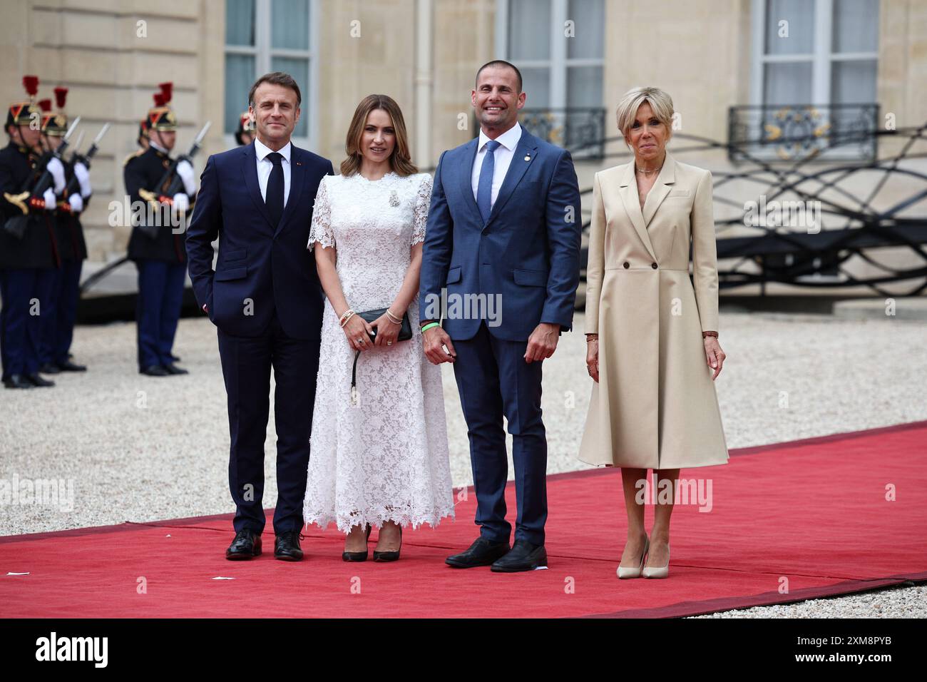 French President Emmanuel Macron, guest and Brigitte Macron attending ...