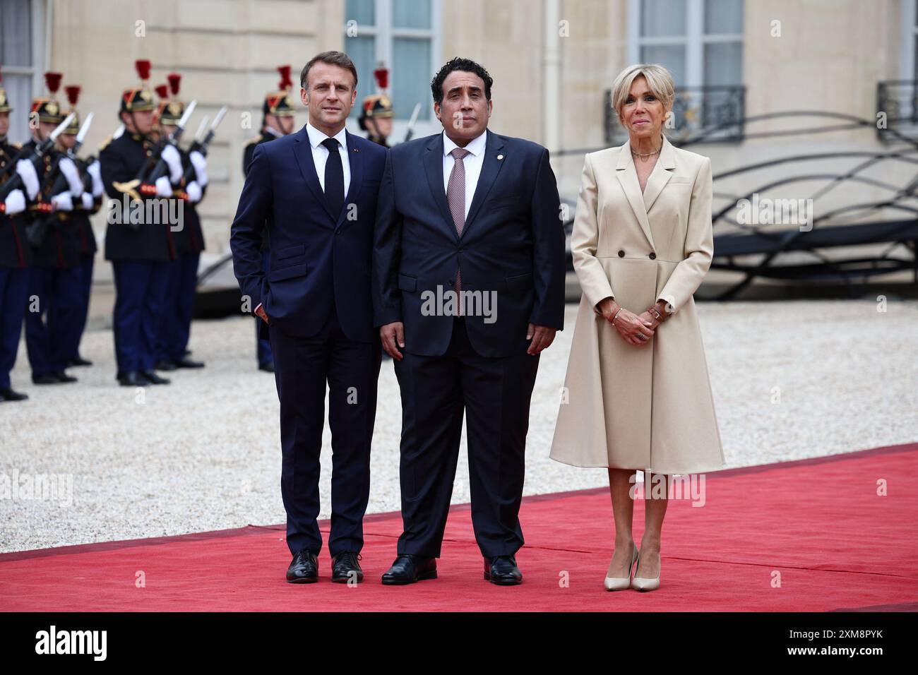 French President Emmanuel Macron, guest and Brigitte Macron attending ...