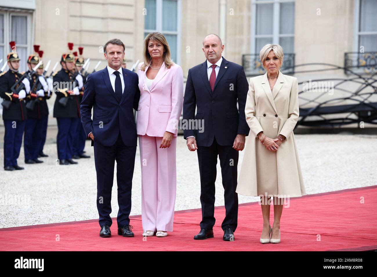 French President Emmanuel Macron, guest and Brigitte Macron attending ...