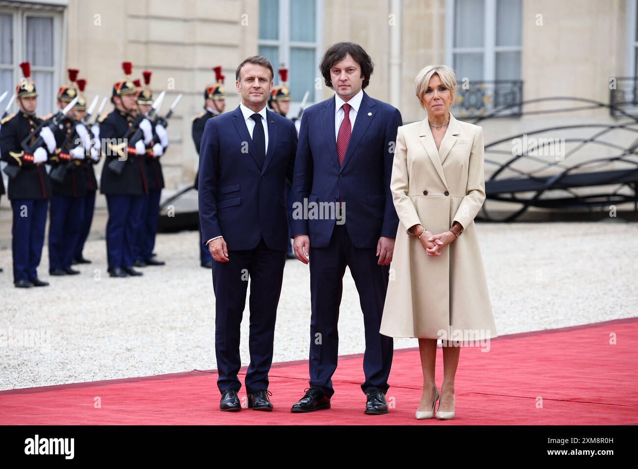 French president Emmanuel Macron, guest and Brigitte Macron attending ...