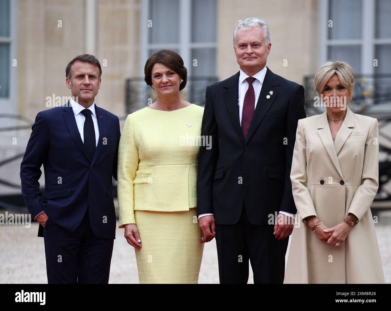 French President Emmanuel Macron, guest and Brigitte Macron attending ...