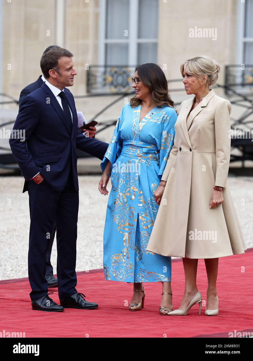 French President Emmanuel Macron, guest and Brigitte Macron attending ...