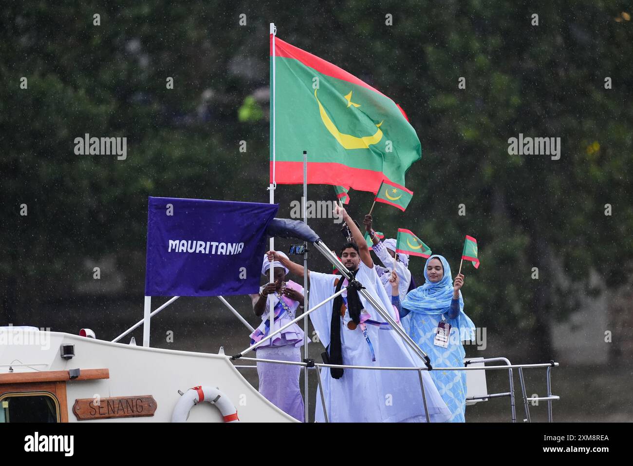 The Mauritania flagbearers Salam Bouha Ahamdy, Camil Doua, and Emiliano ...