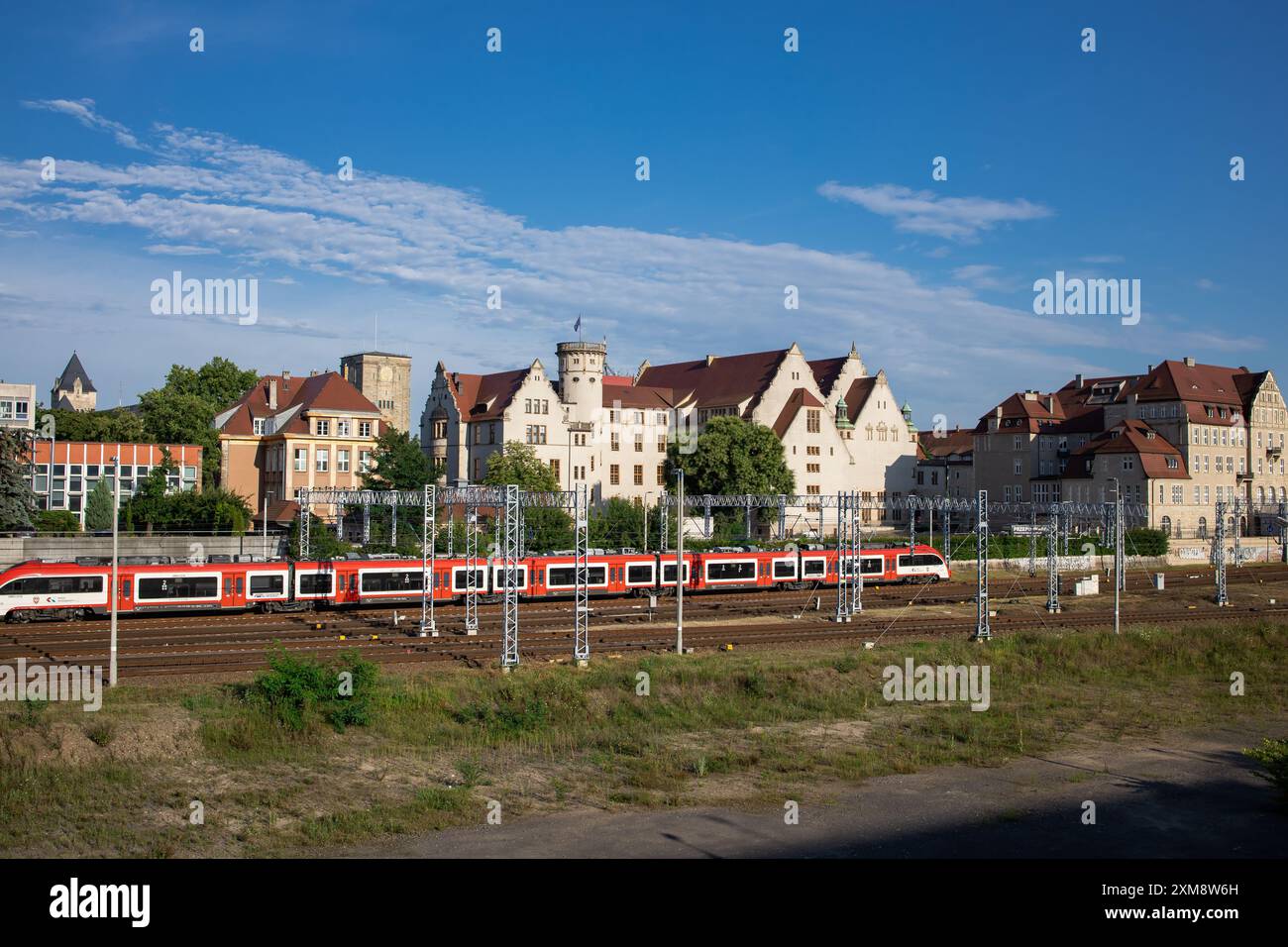 Main campus of Adam Mitskevich University and city train on railway in ...