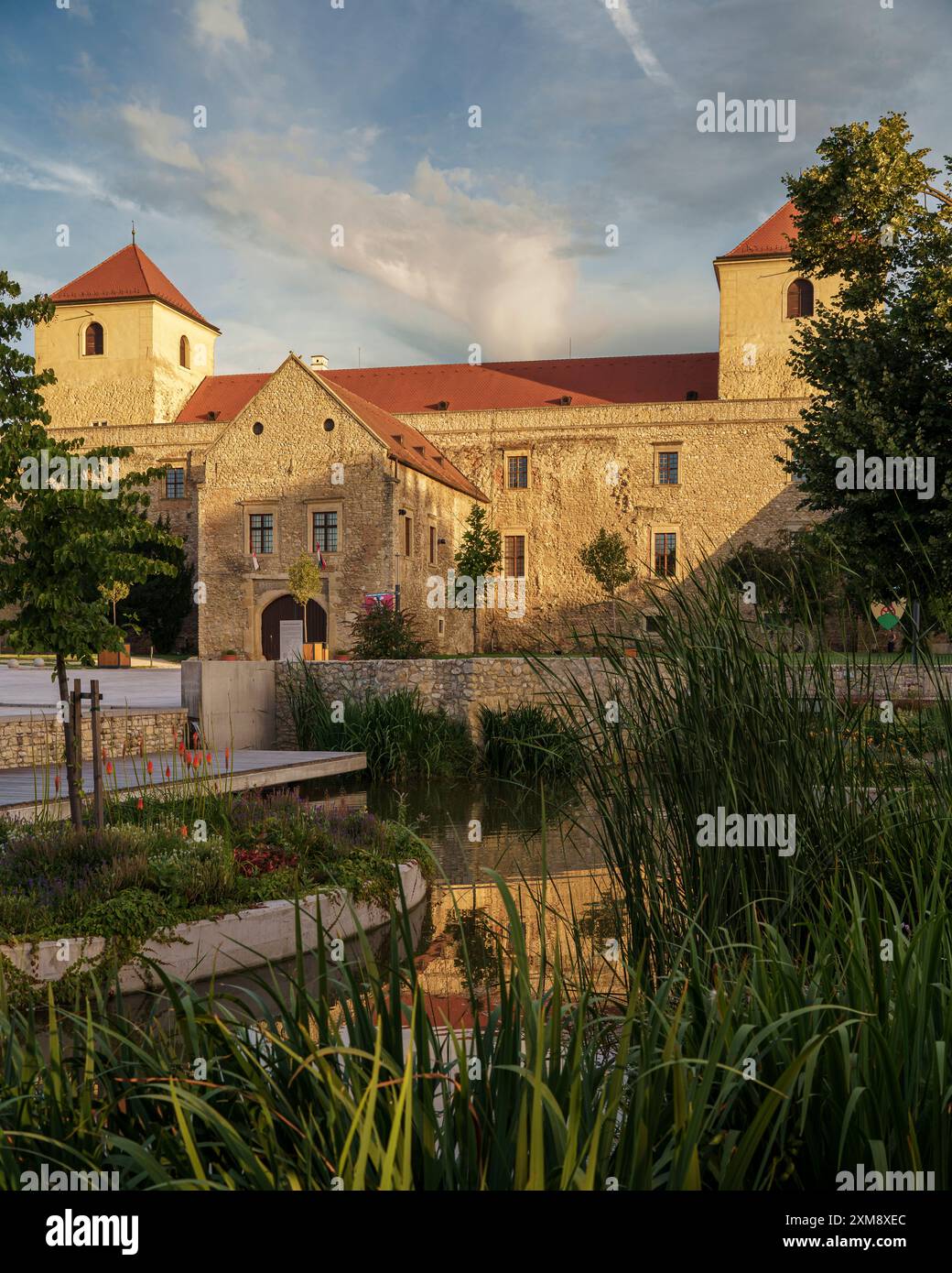 Aerial view of Varpalota Thury castle with newly renovated red orange roof, four rectangular ...